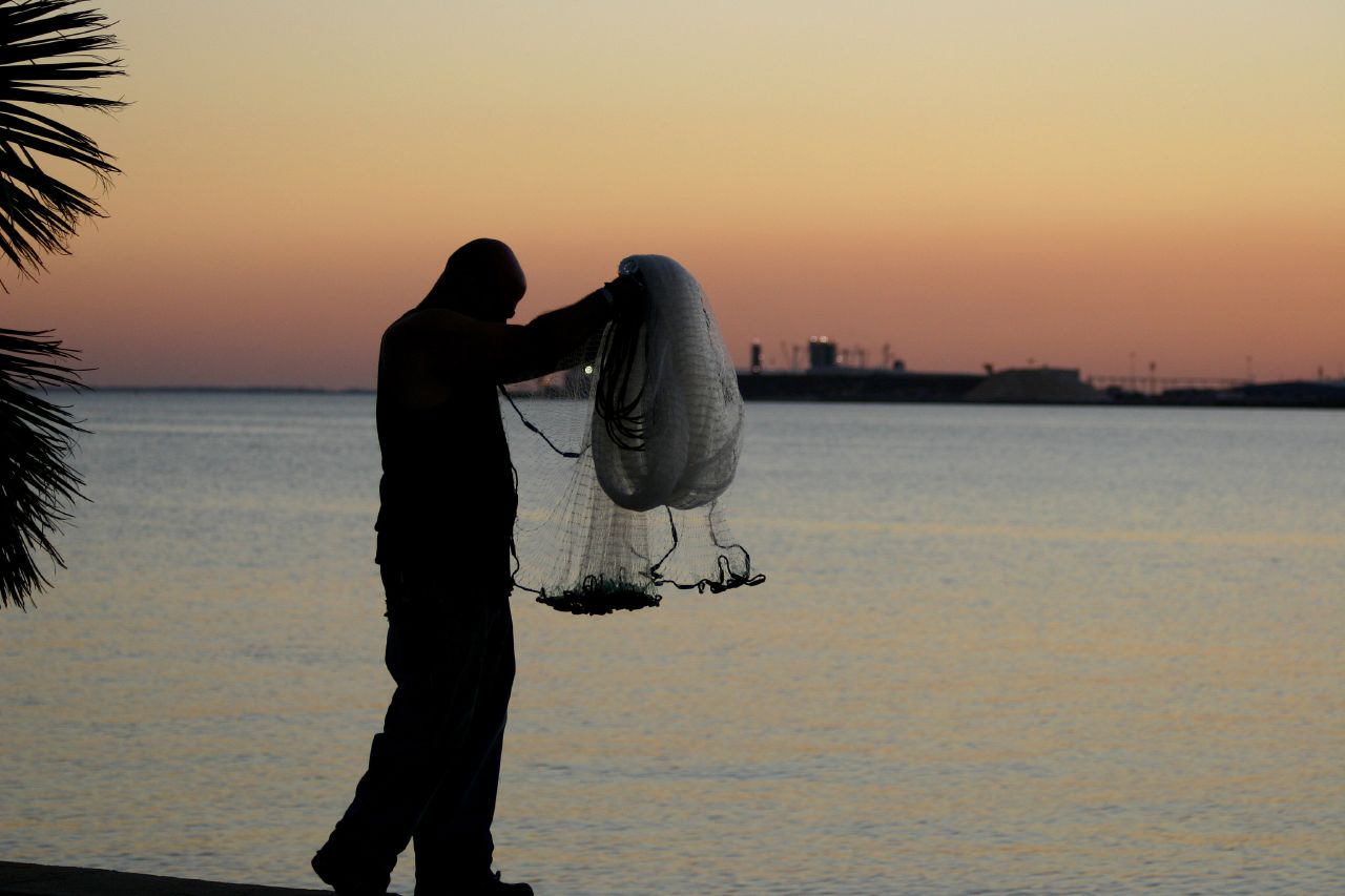 casting for mullet | fisherman using a cast net to catch mul… | Flickr
